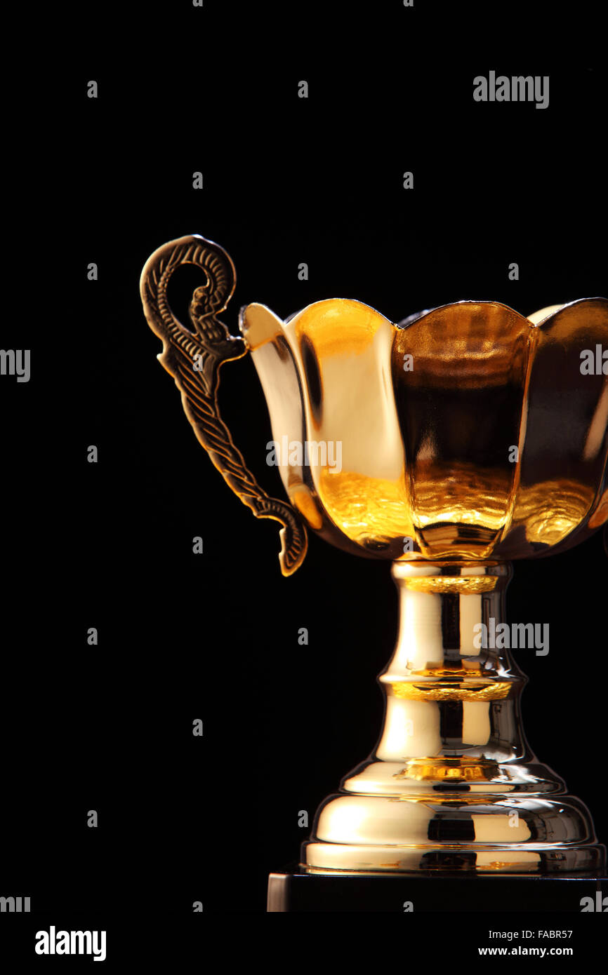 golden champion trophy on the black Stock Photo - Alamy