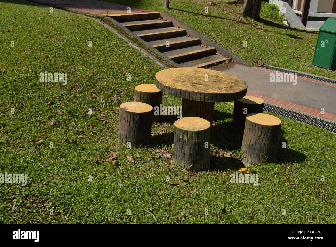 relax in the park after workout: wooden table and chair between ...