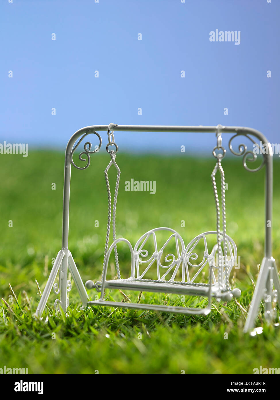 hand made mini swing on the grass Stock Photo - Alamy