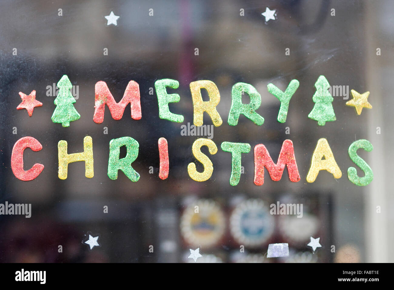 Colorful Merry Christmas sign on a window Stock Photo - Alamy