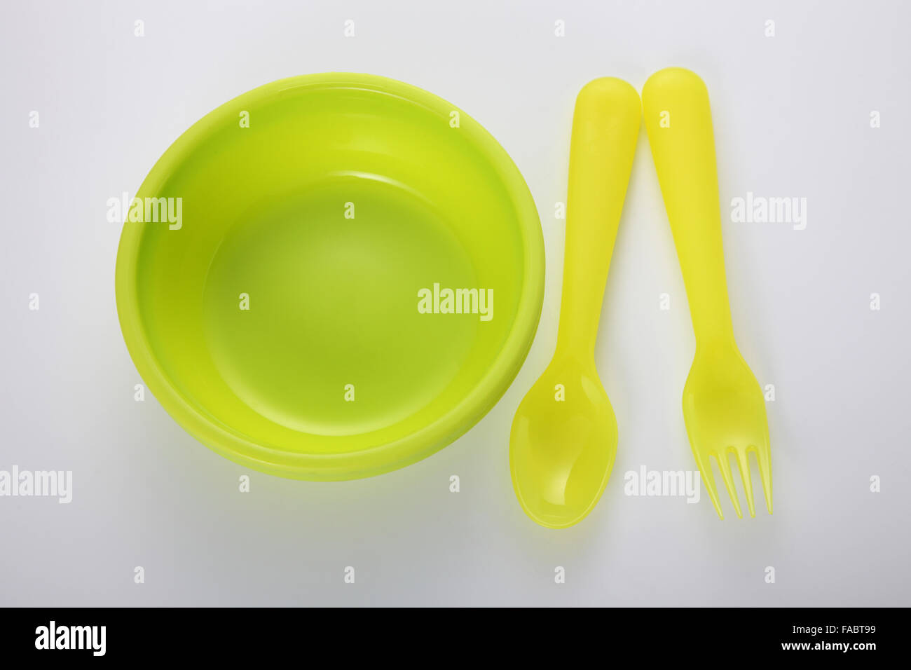 yellow plastic bowl on the white background Stock Photo - Alamy