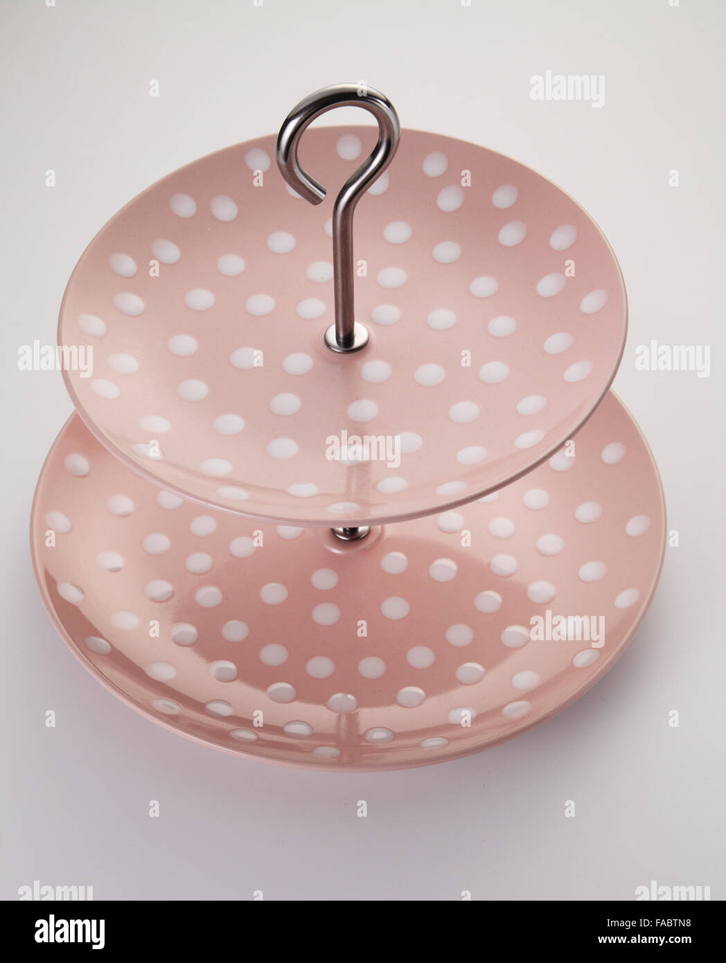 two tiers candy tray on the gray background Stock Photo - Alamy