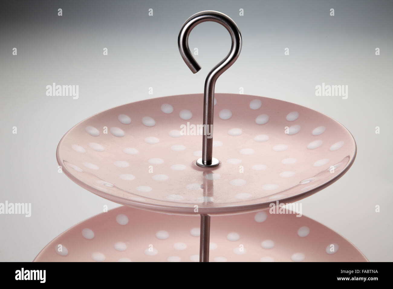two tiers candy tray on the gray background Stock Photo - Alamy
