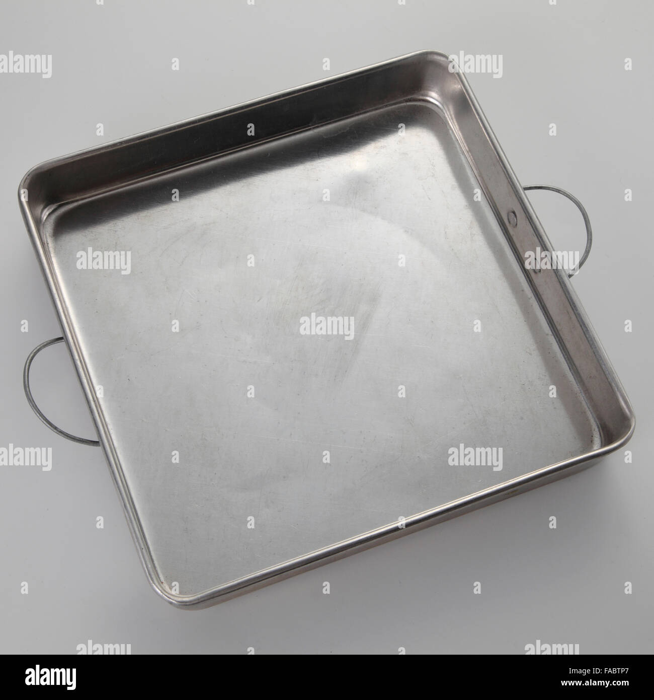 used baking tray on the white background Stock Photo - Alamy