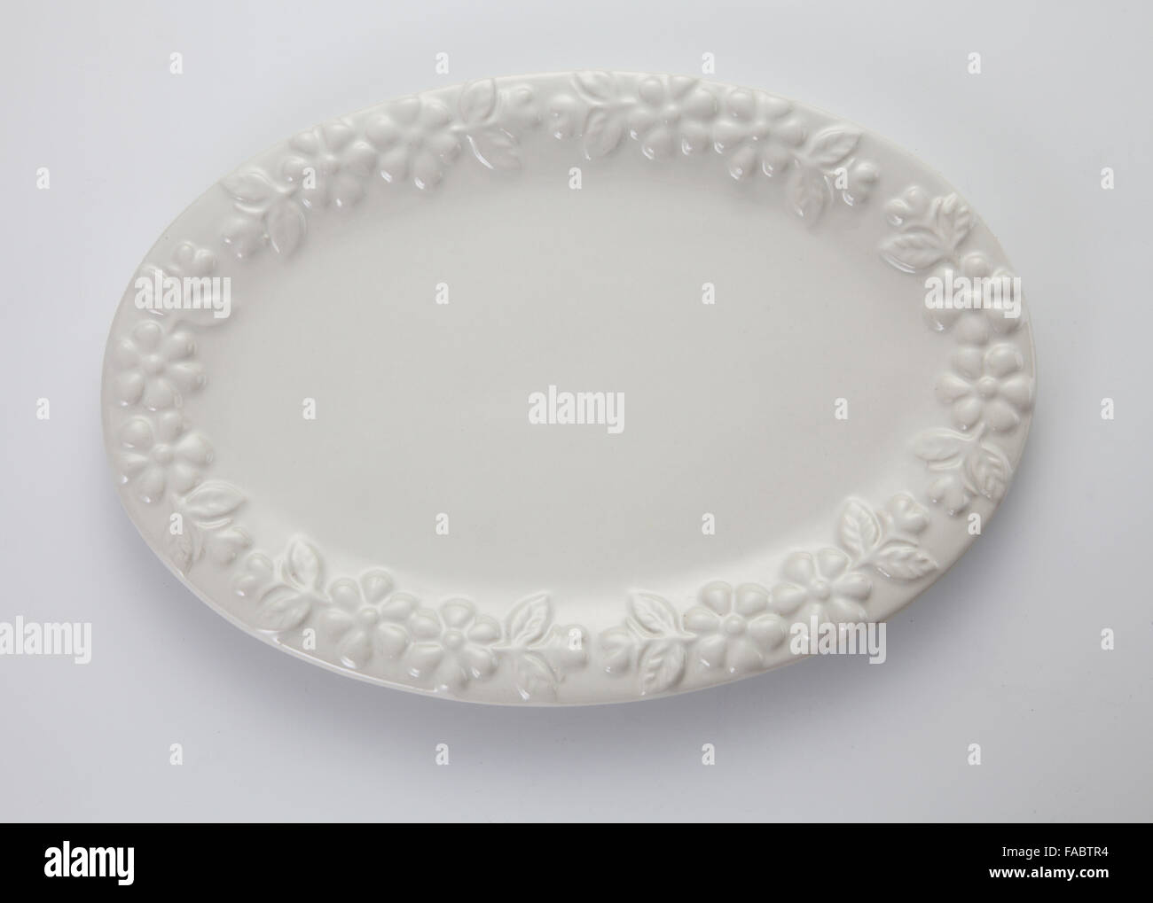 oval shaped plate on the white background Stock Photo - Alamy