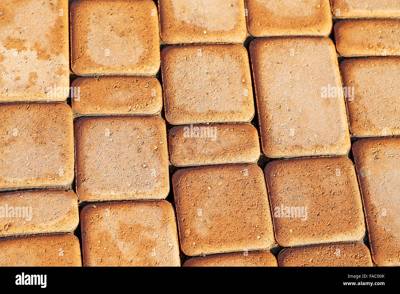 Beautiful red tiles on the ground photographed close up Stock Photo - Alamy