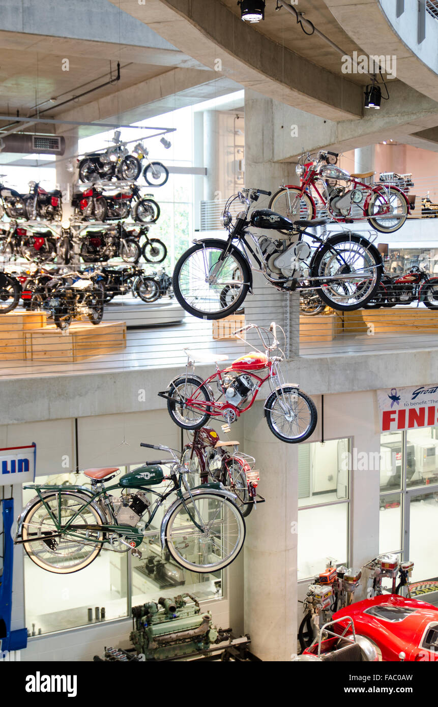 A display of motorcycles hangs from the ceiling at the Barber Vintage ...