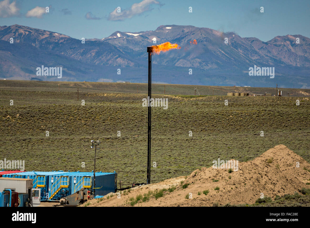 An oil fracking well site and burn off tower to remove natural gas from ...