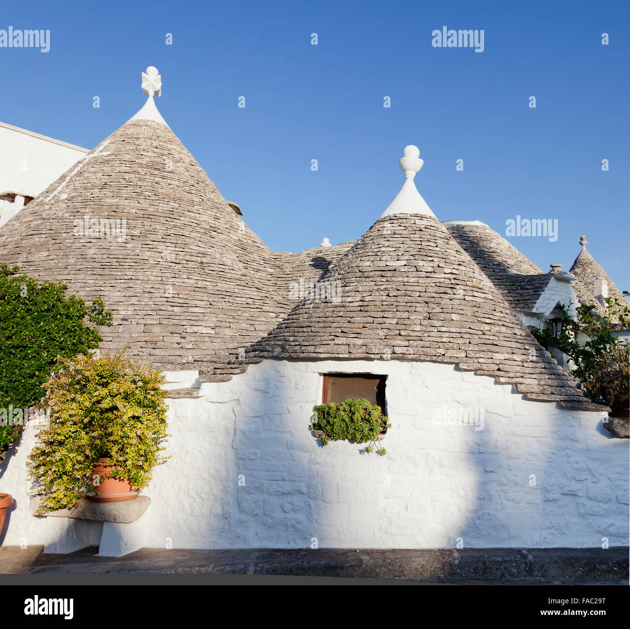 Typical trulli buildings with conical roofs in Alberobello, Apulia ...