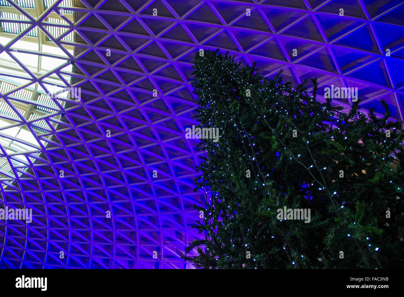 symmetrical architecture at Kings Cross station London, lit with a blue ...