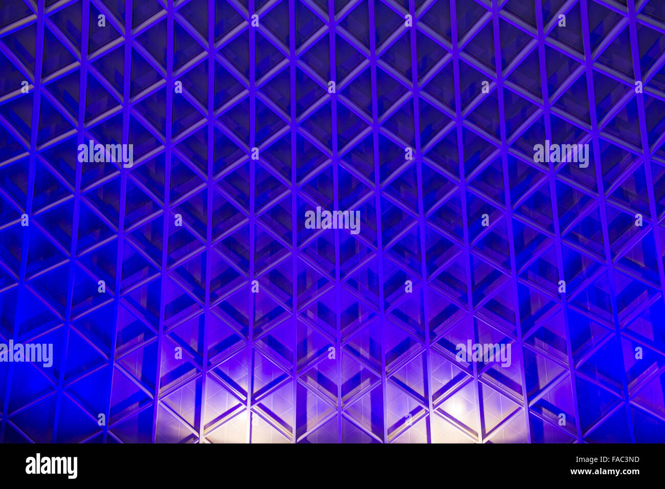 symmetrical architecture at Kings Cross station London, lit with a blue ...