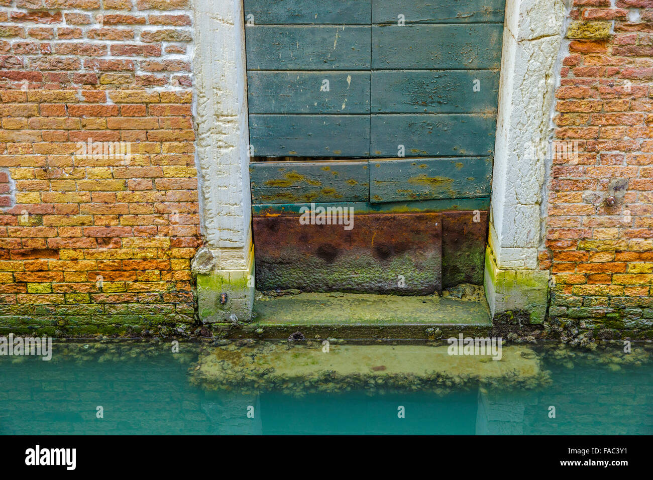 steps and door into canal, Venice Stock Photo - Alamy