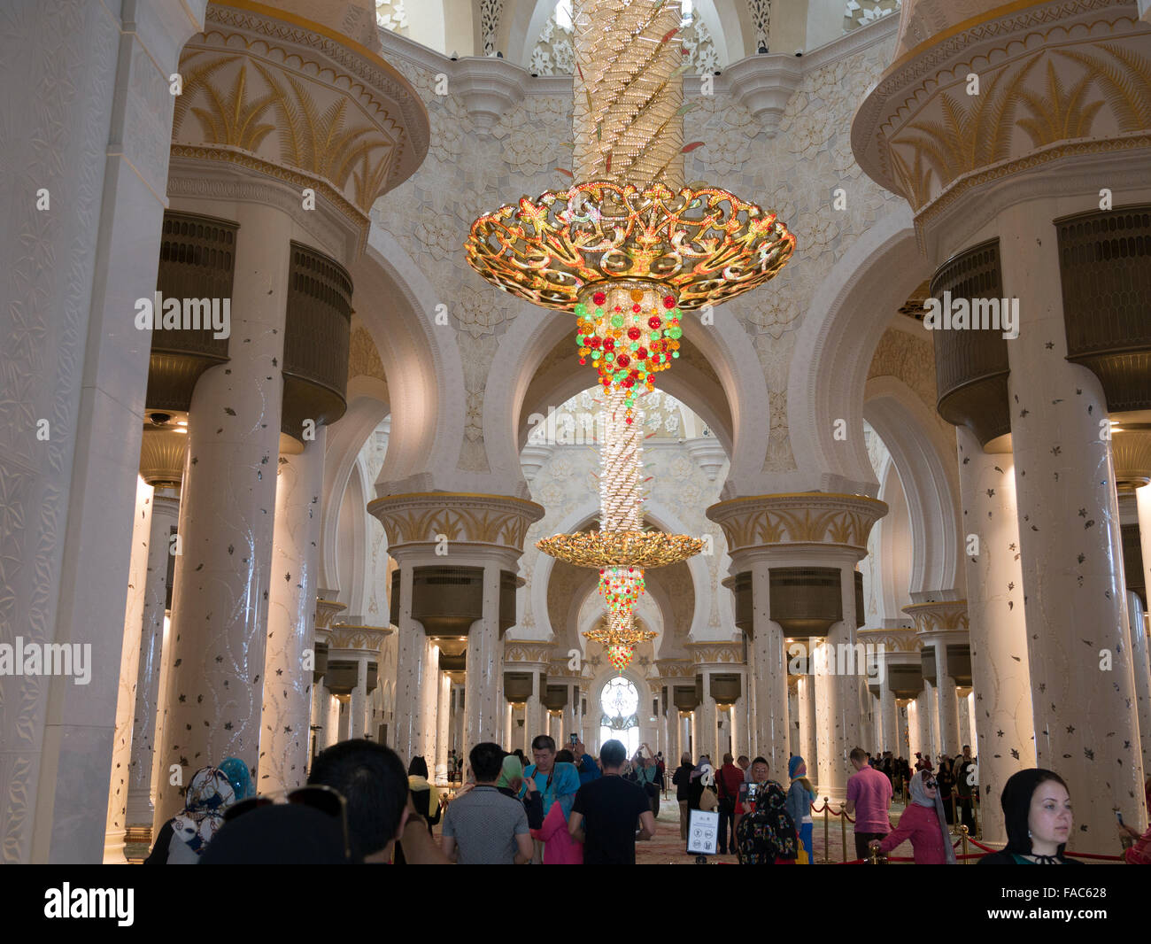Tourists visiting Sheikh Zayed Grand Mosque located in Abu Dhabi, the ...