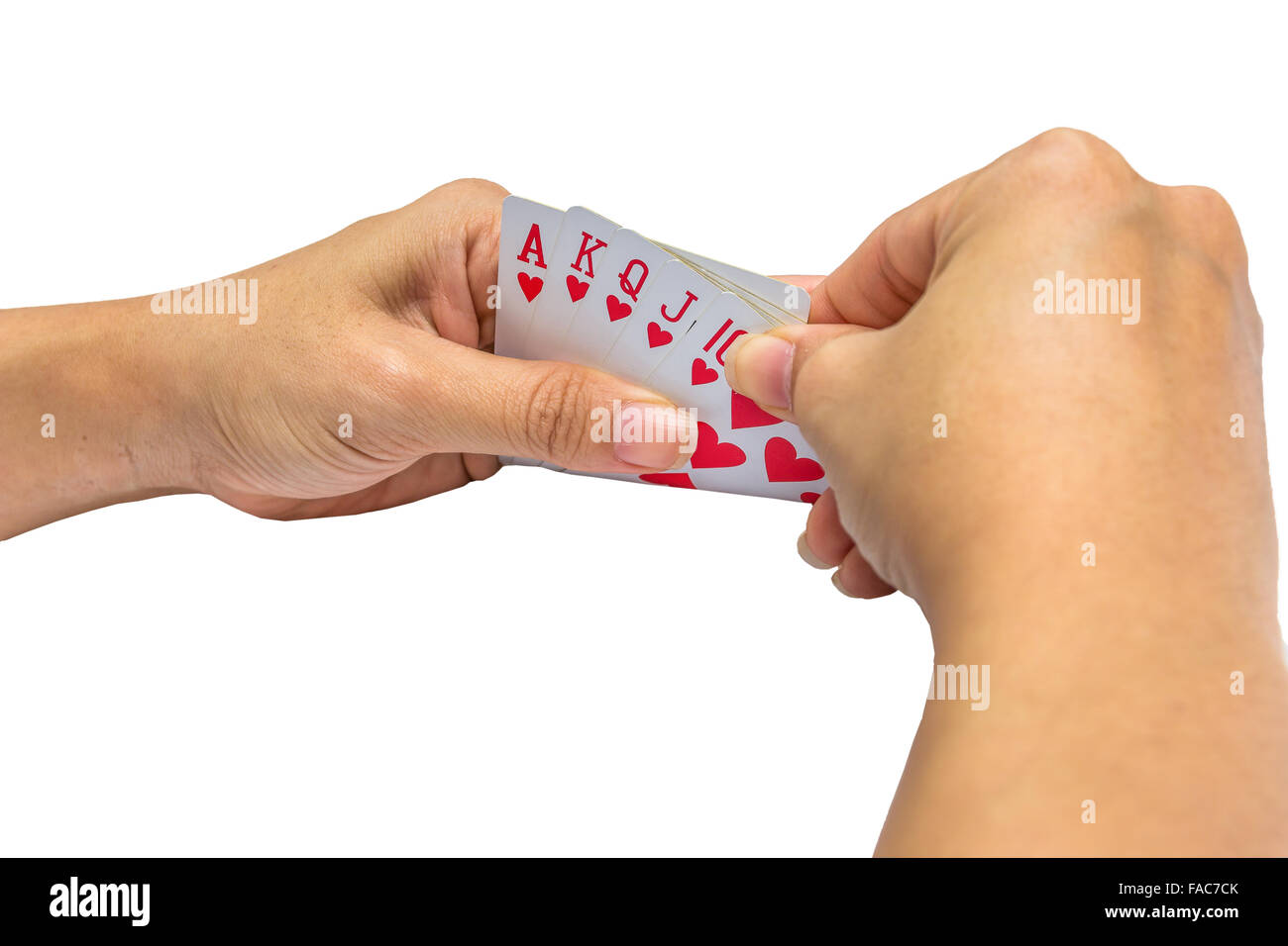 Playing cards in hand isolated on white background Stock Photo - Alamy