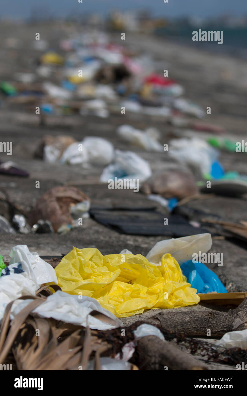 The receding tide leaves a thick line of mainly plastic garbage along ...