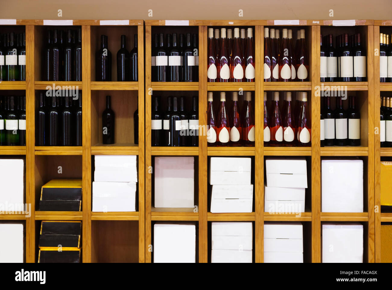 Shelvings with bottles at the wine shop Stock Photo - Alamy