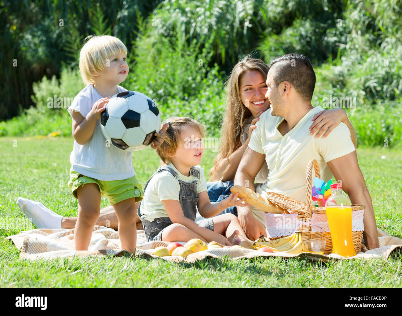 Young family with children having picnic outdoor on sunny day Stock ...