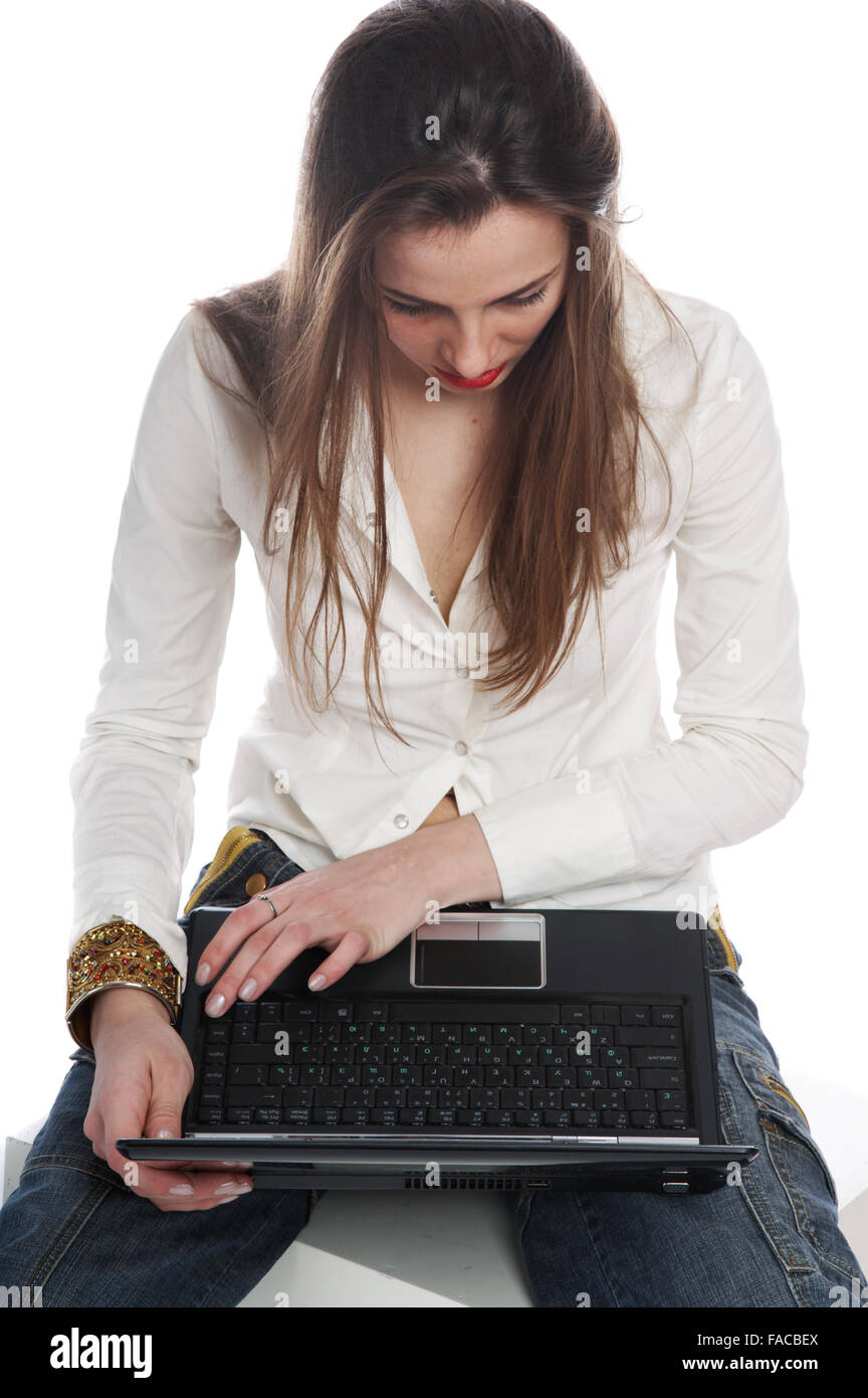 Beautiful girl with a laptop on a white background Stock Photo - Alamy