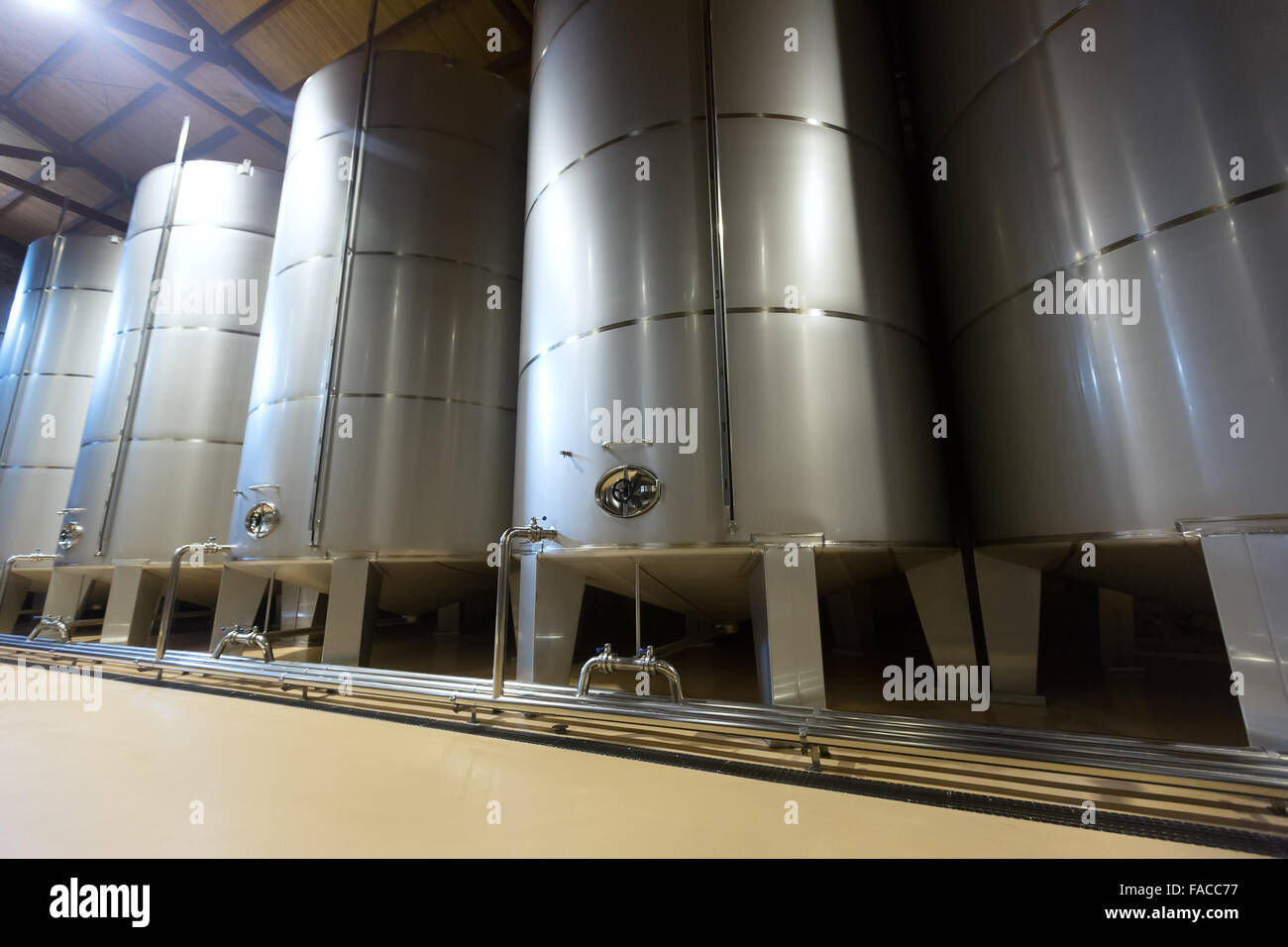 contemporary stell barrels in winery factory Stock Photo - Alamy