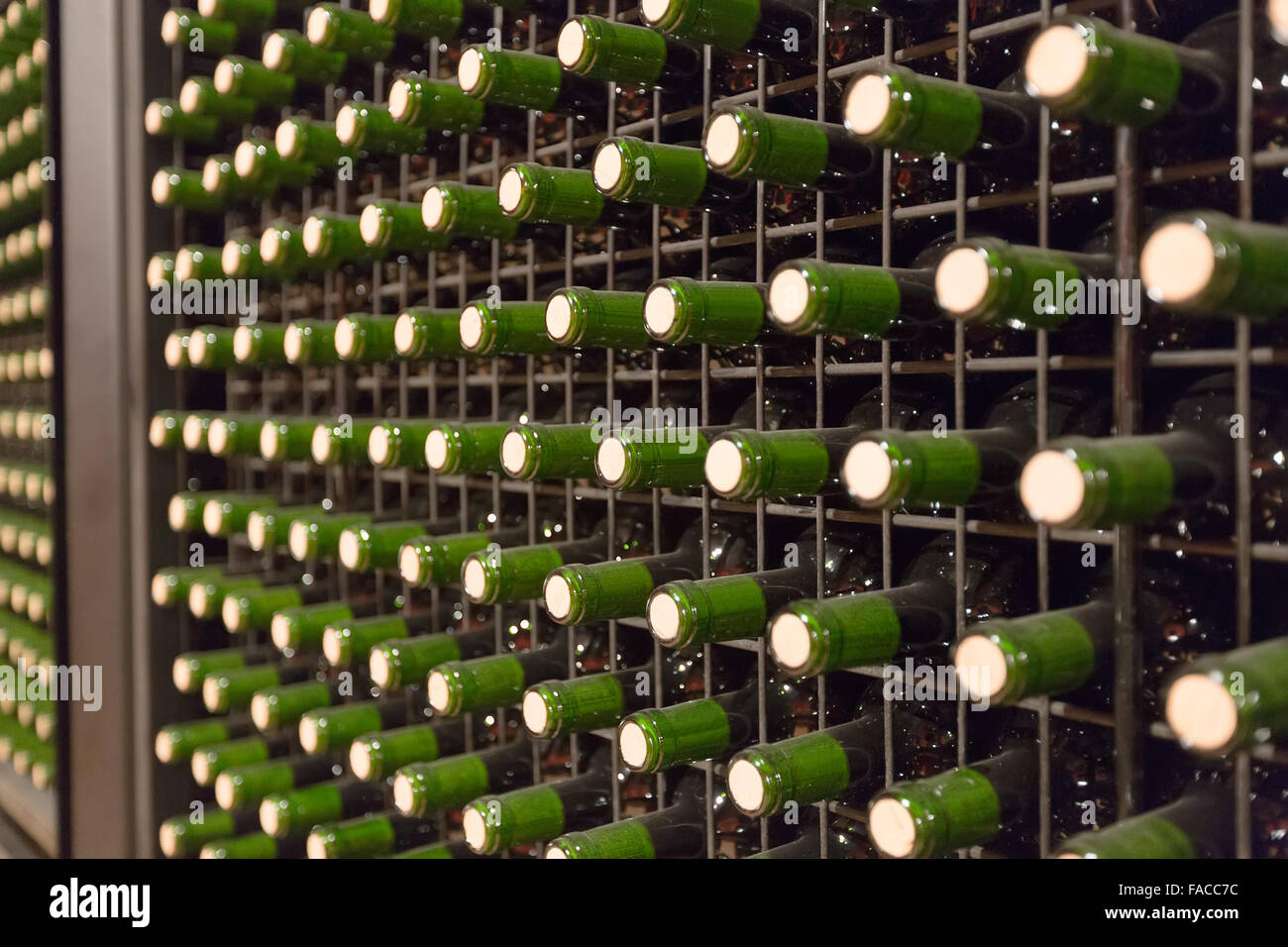 Rows of wine glass bottles in winery Stock Photo - Alamy