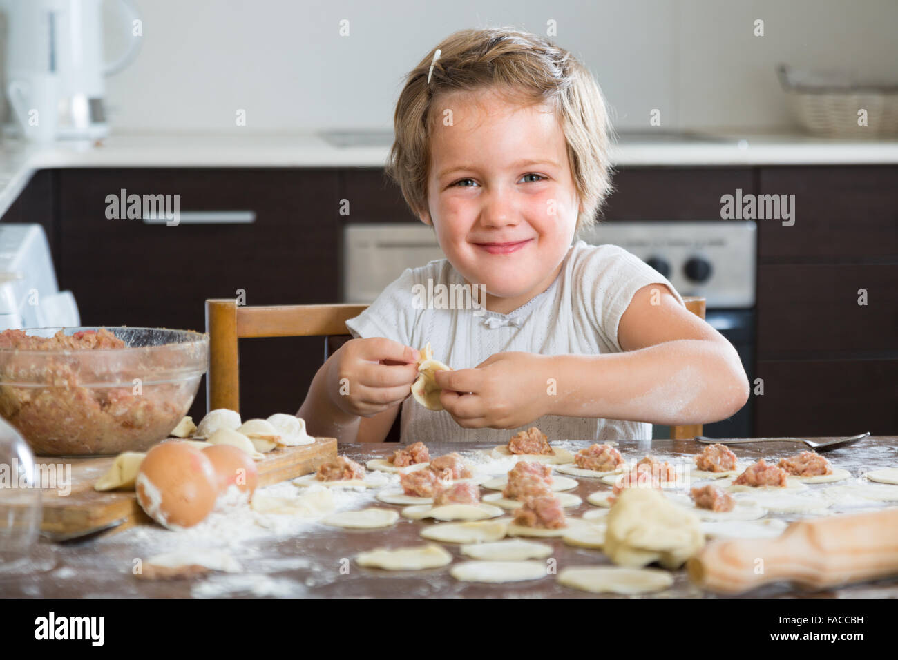 Happy child cooking meat dumplings hi-res stock photography and images ...