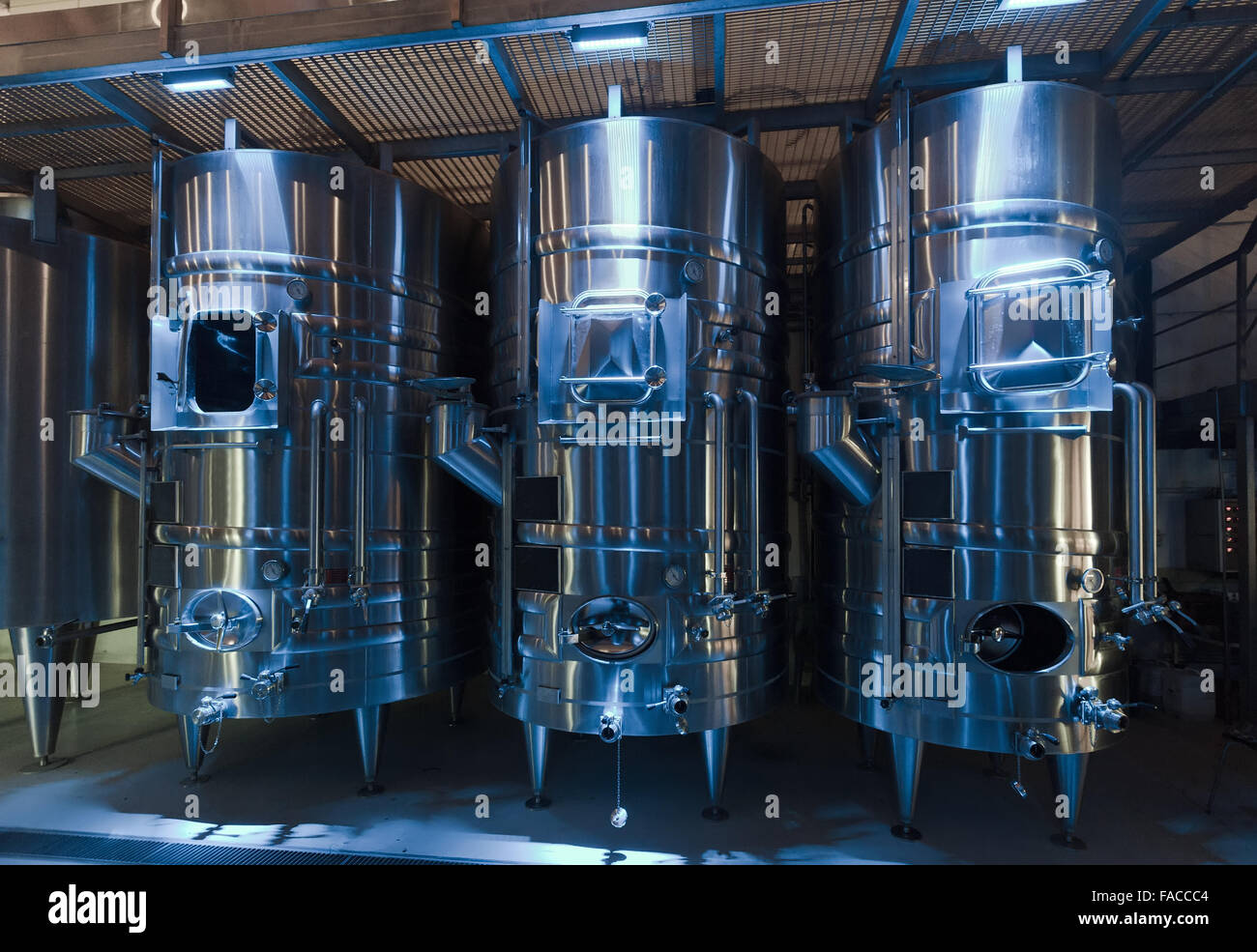 contemporary large stell barrels in winemaker Stock Photo - Alamy