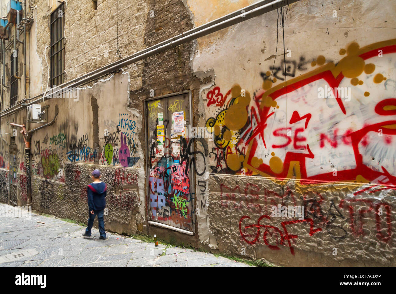Ancient wall with graffiti on the street in historic center of Naples ...