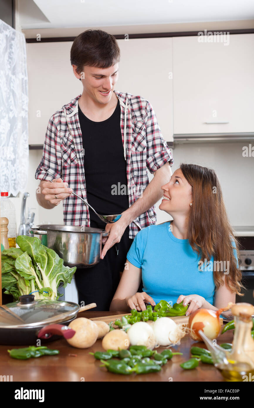 Family together cooking in domestic kitchen Stock Photo - Alamy
