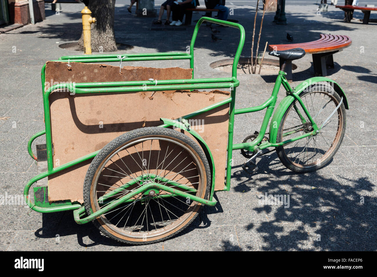 Green rickshaw bike with a large space for transporting goods at the ...