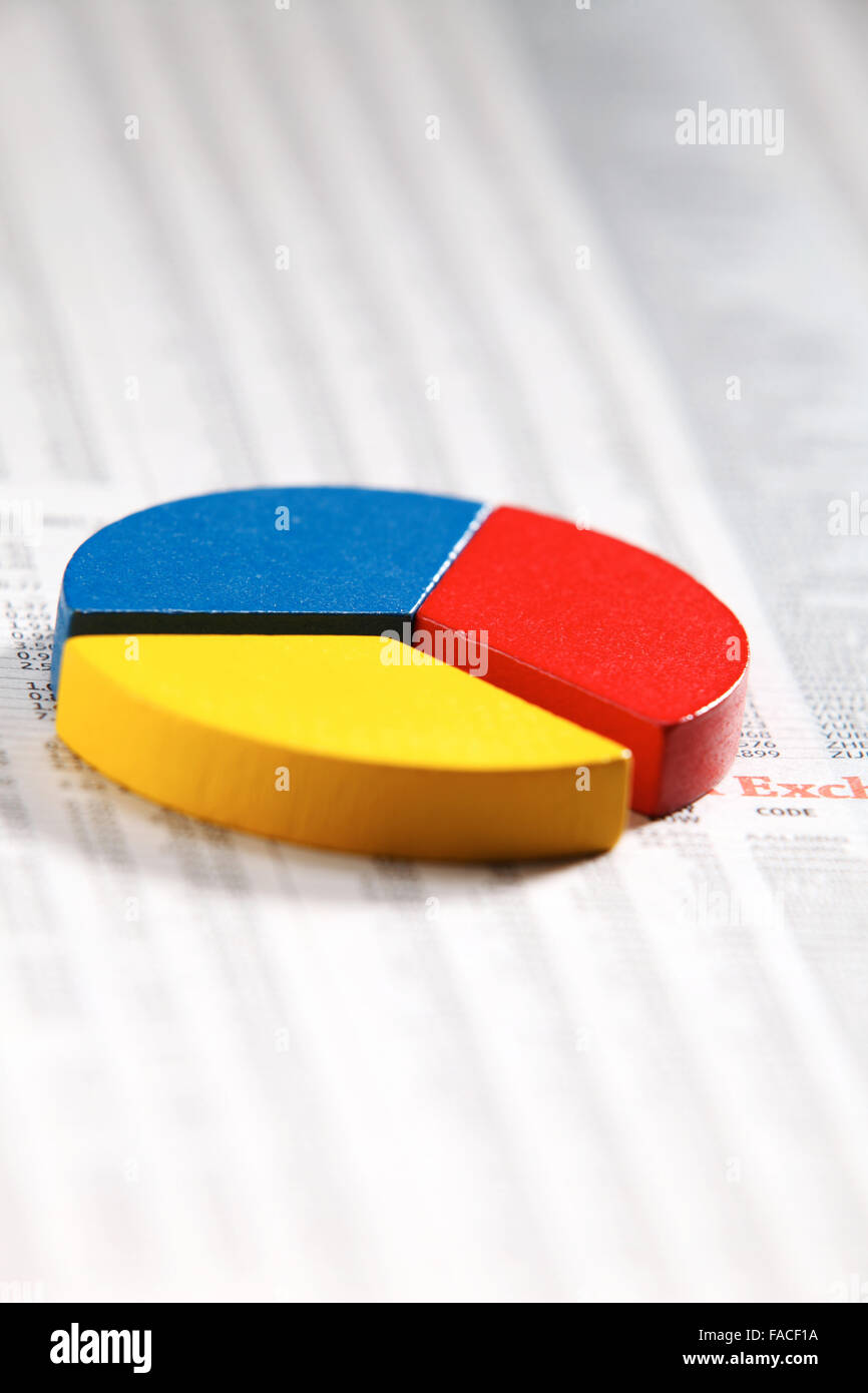 colorful wooden chart on the news paper Stock Photo - Alamy