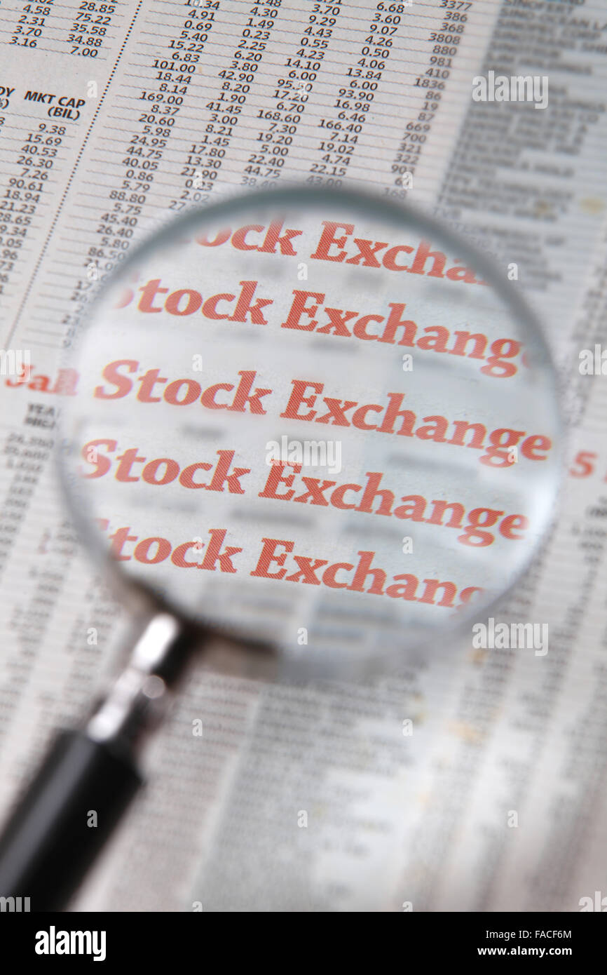 magnifier focus on the stock market Stock Photo - Alamy