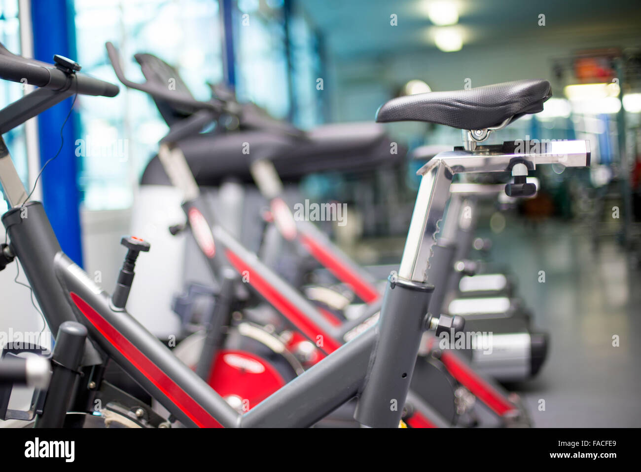 Bikes in the gym Stock Photo - Alamy