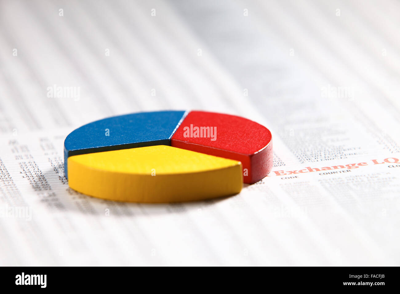 colorful wooden chart on the news paper Stock Photo - Alamy