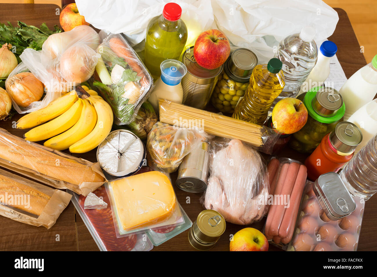 food purchases from supermarket on table in home Stock Photo - Alamy