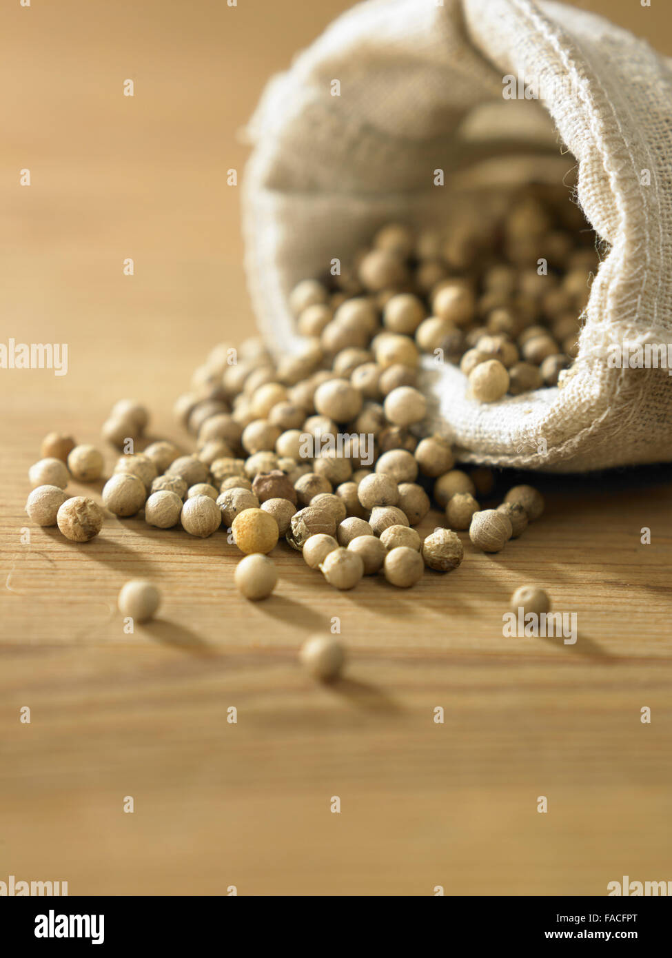 pepper corn pouring out from the bag Stock Photo - Alamy