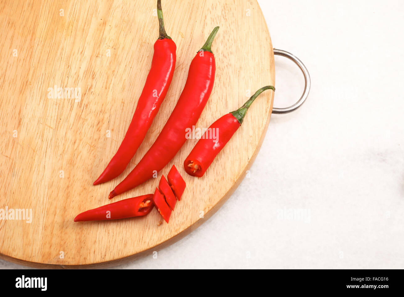 chilli on the chopping board Stock Photo - Alamy