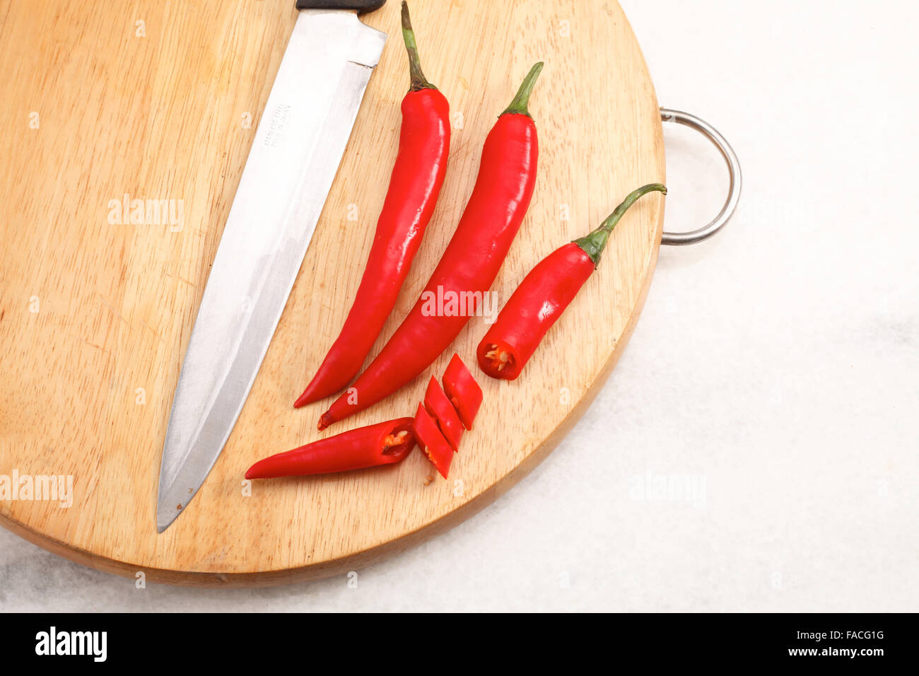 chilli on the chopping board Stock Photo - Alamy