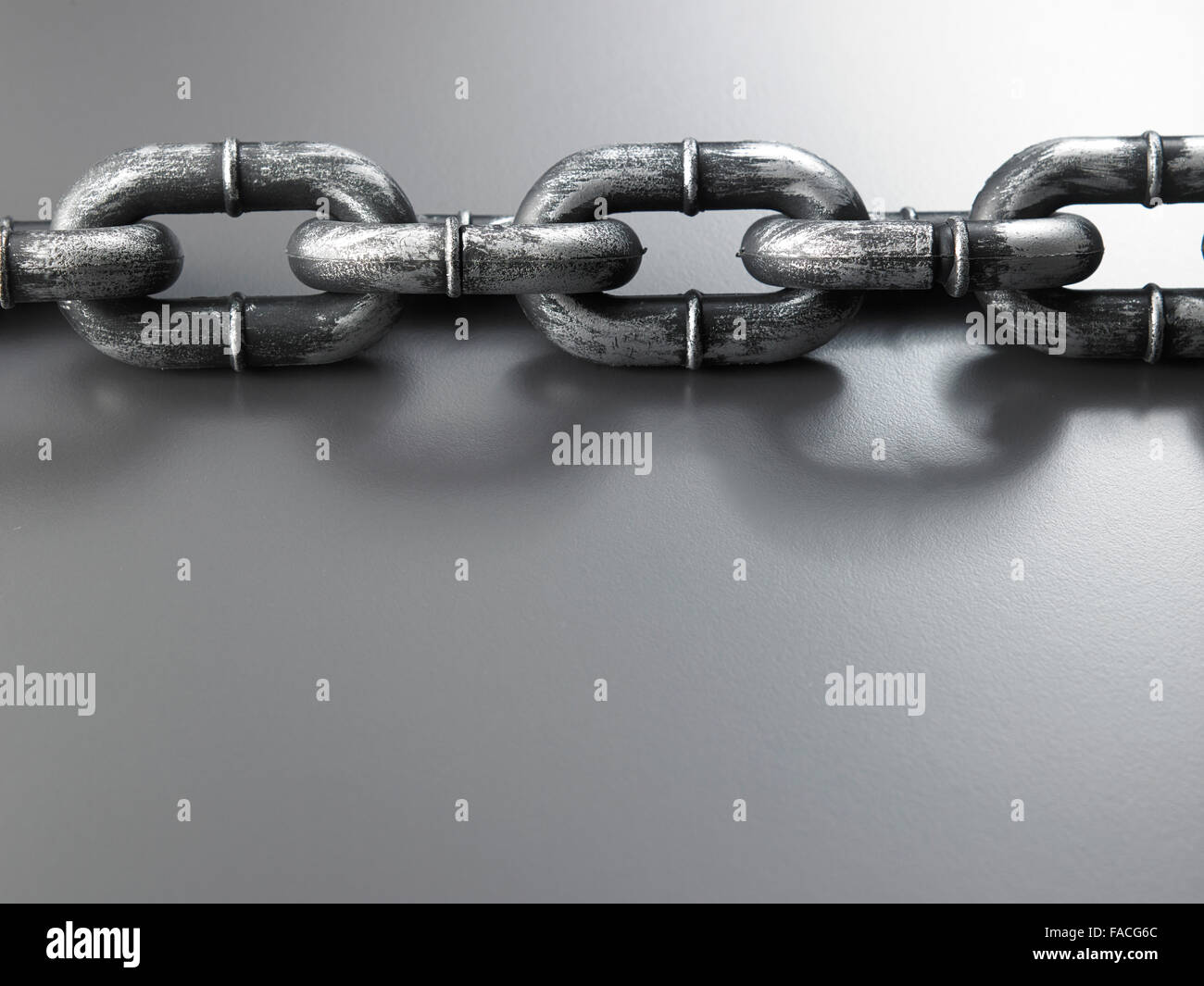 Galvanized chain on the gray background Stock Photo - Alamy