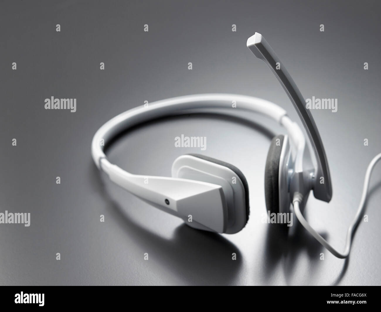 White audio headphones with microphone Stock Photo - Alamy