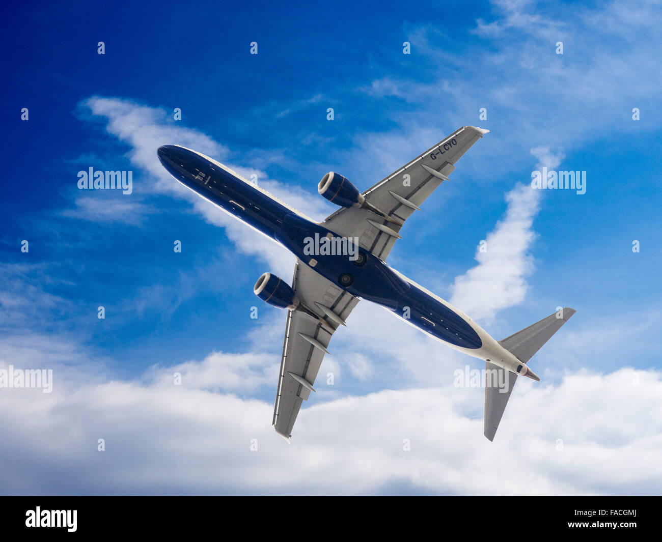 V shaped clouds in the sky, with a plane going over Stock Photo - Alamy