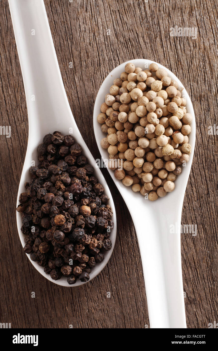 two spoons with pepper corns Stock Photo - Alamy