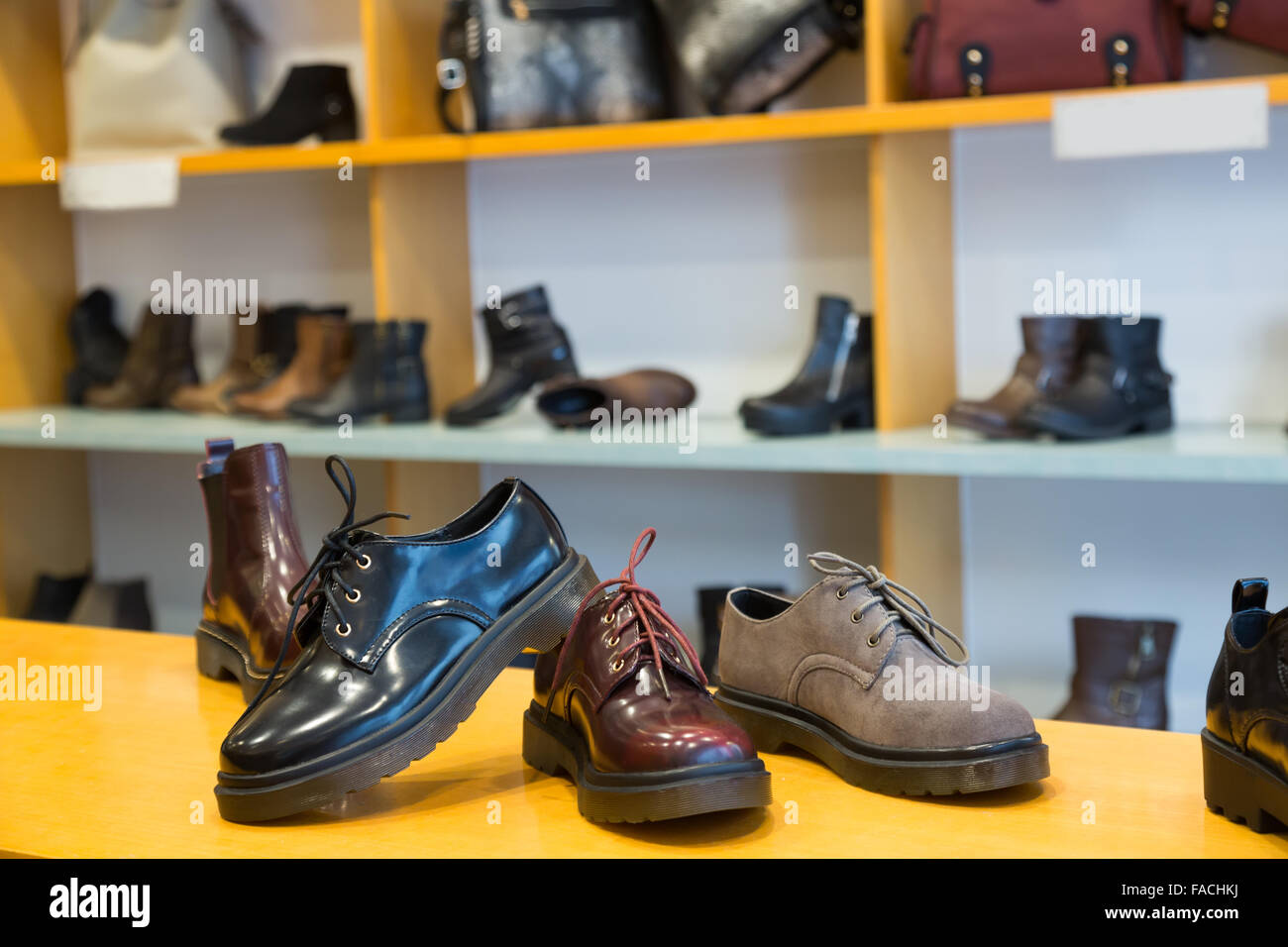 Counter with classic male shoes at fashionable shop Stock Photo - Alamy