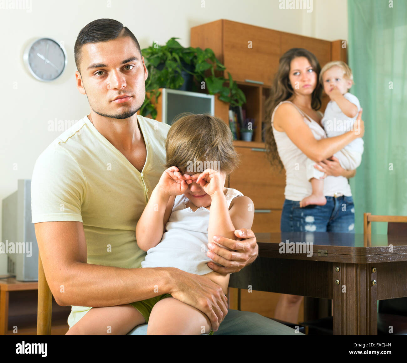 family with two little children having conflict at home Stock Photo - Alamy