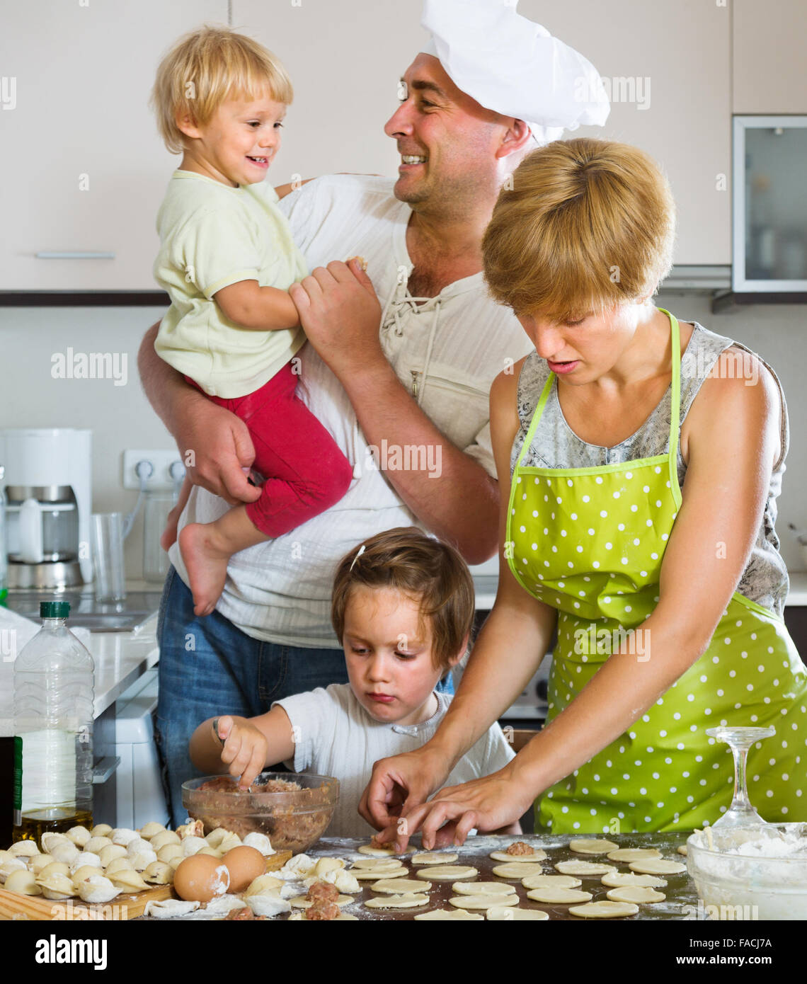 Parents and children prepare food person cooking hi-res stock ...