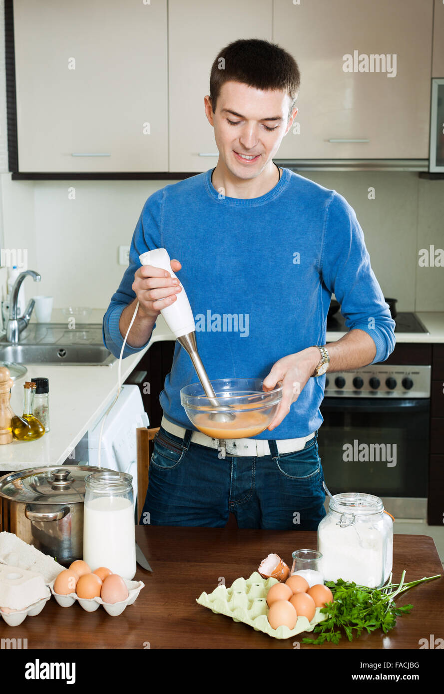 european man cooking omelet at kitchen Stock Photo - Alamy