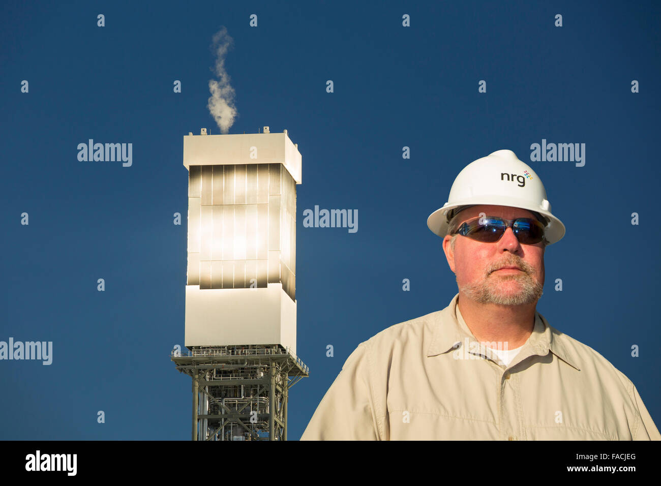 A solar tower venting steam at the Ivanpah Solar Thermal Power Plant in ...