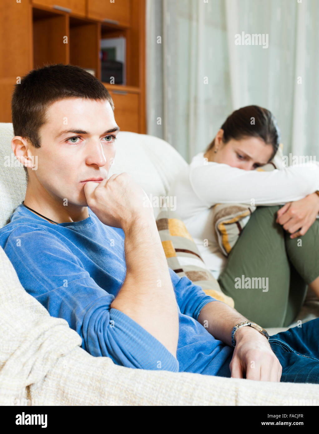 Portrait sad young woman listening hi-res stock photography and images ...