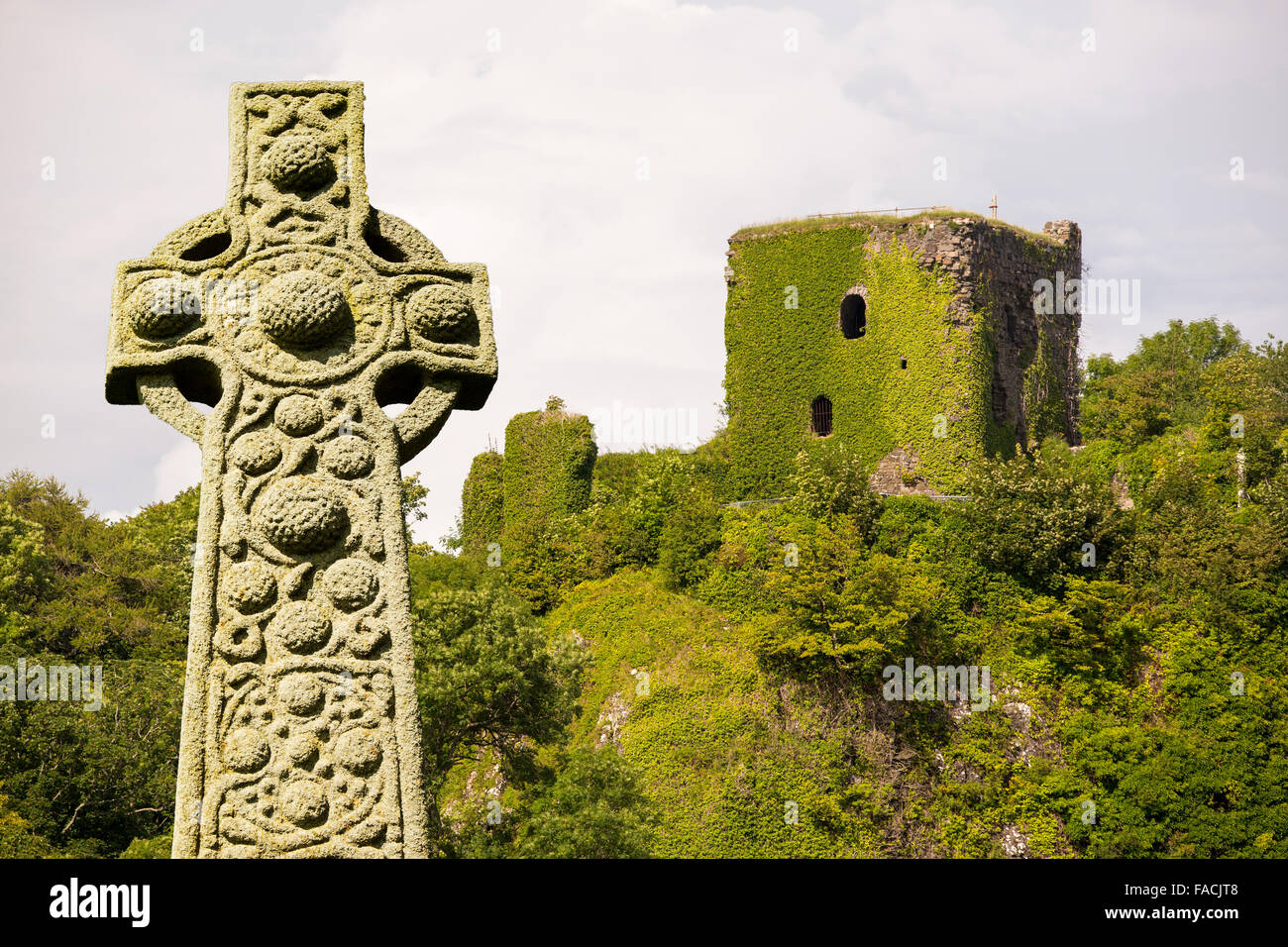 Dunollie Castle, Oban, Scotland, UK and a stone cross composite Stock ...