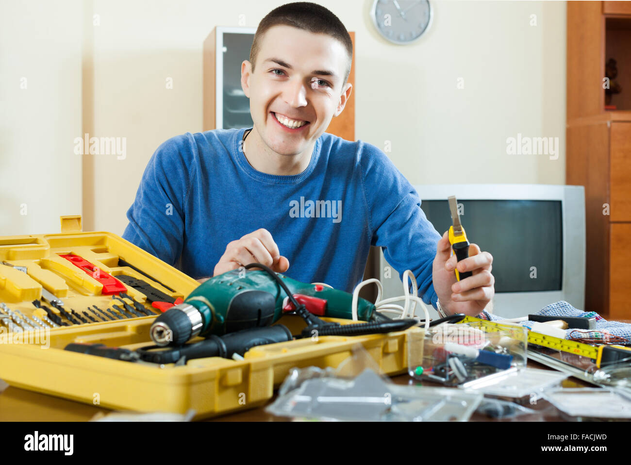 Man doing something with working tools Stock Photo - Alamy
