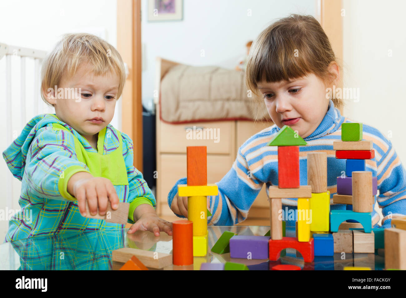 Two serious children in home interior Stock Photo - Alamy